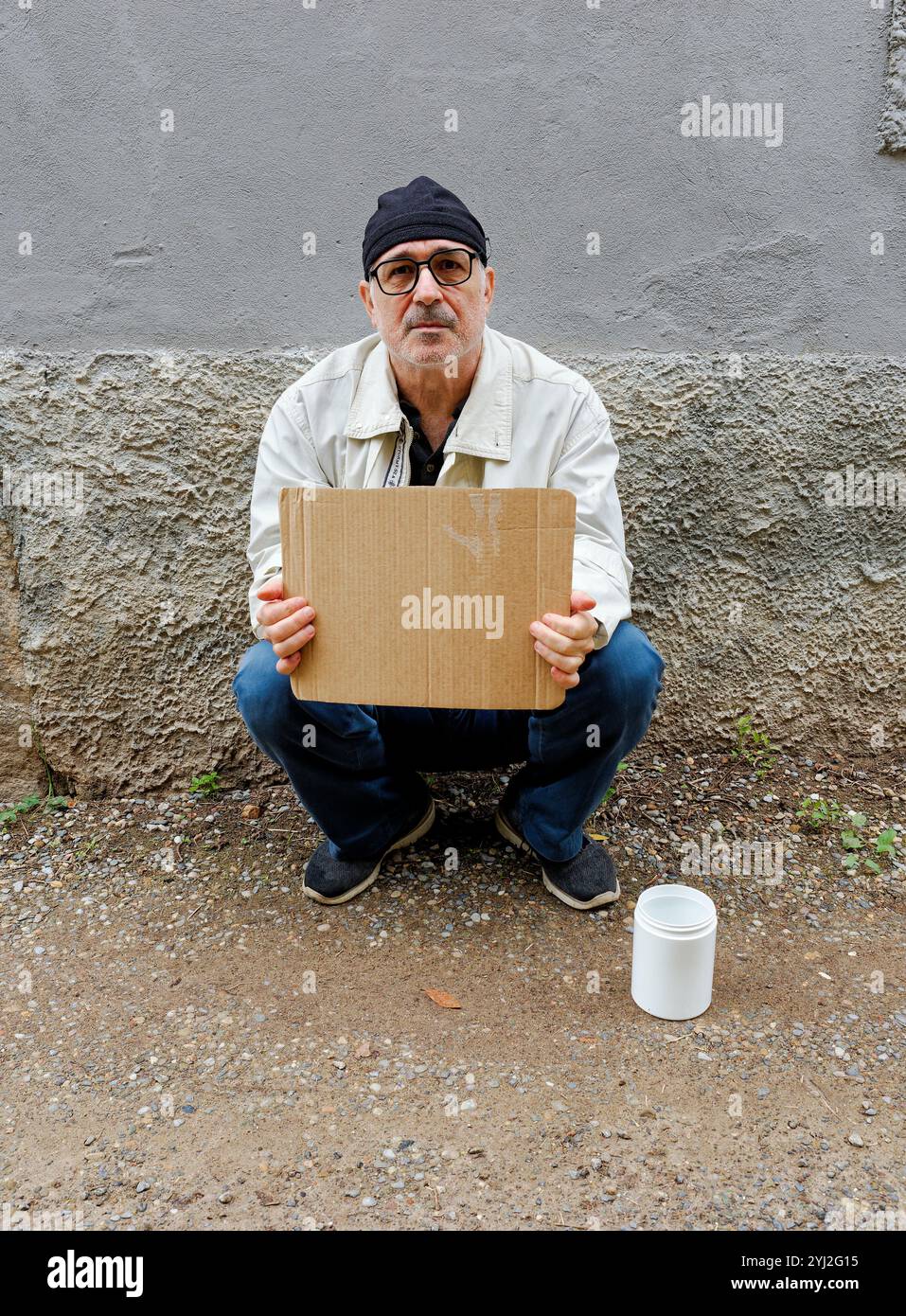Homeless man holding cardboard sign hi-res stock photography and images ...