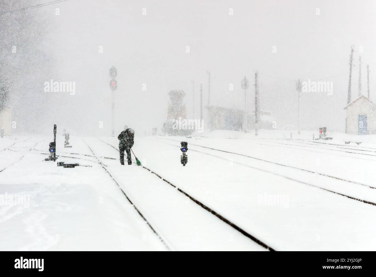Snow covered railway in winter time. Snow covered railway tracks during ...