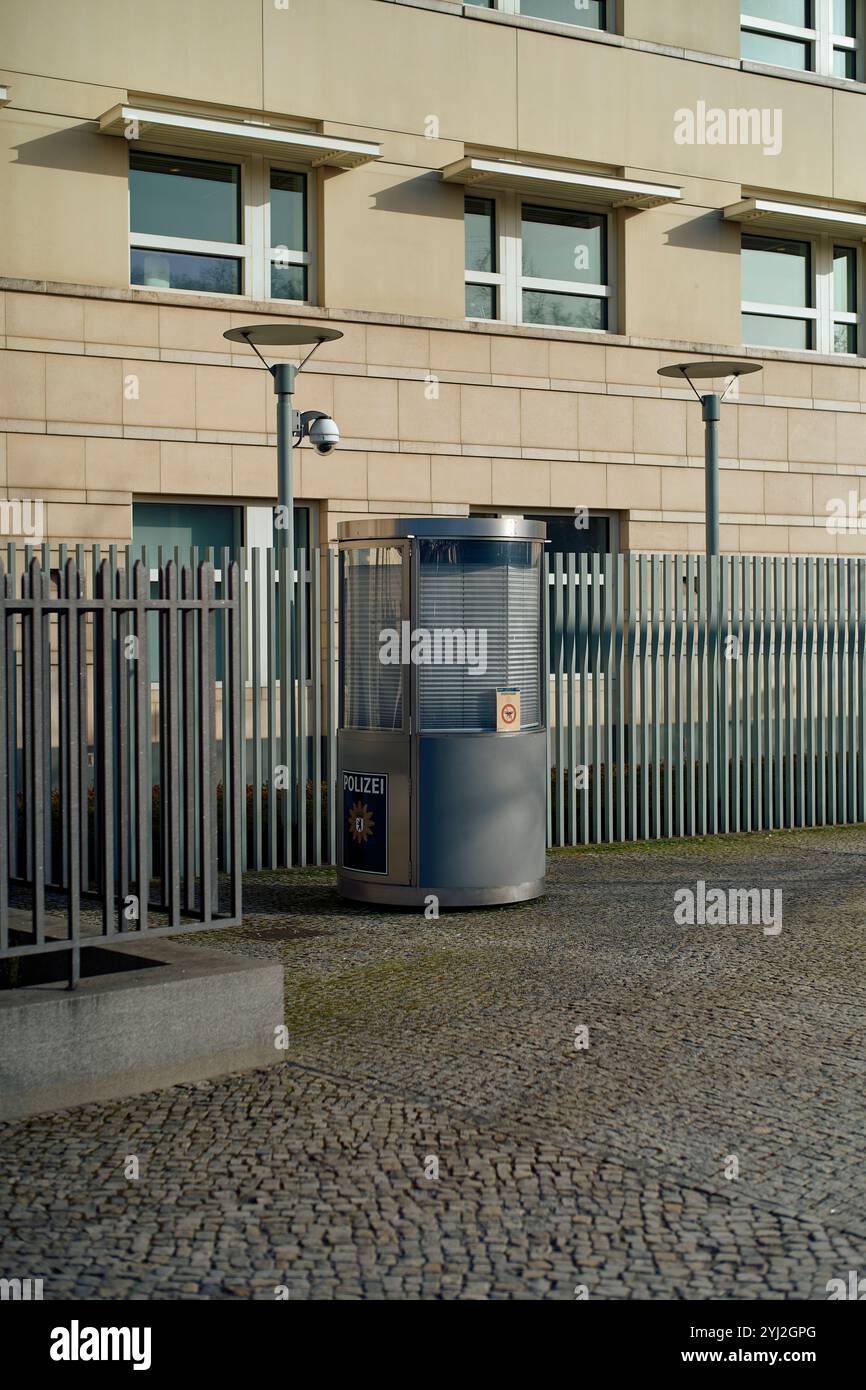 Secured entrance situated cobblestone sidewalk front metal fence ...