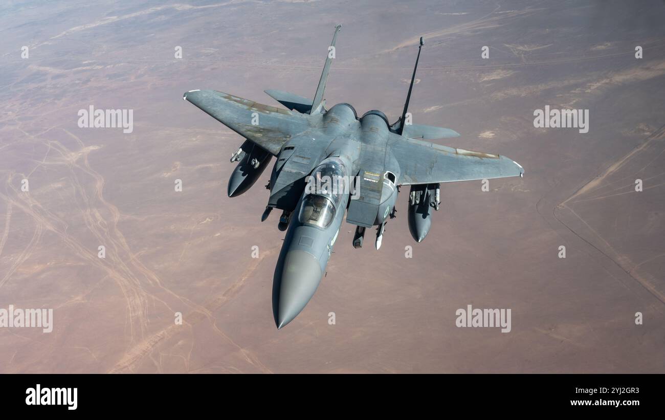 A U.S. Air Force F-15E Strike Eagle conducts combat patrols over the U.S. Central Command ...