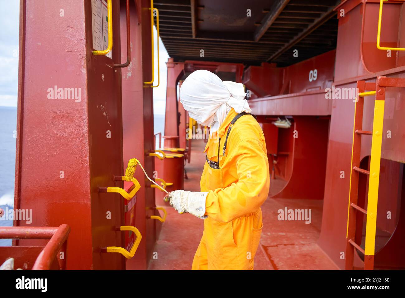 Red ship deck where worker painting handles ladders yellow paint hi-res ...