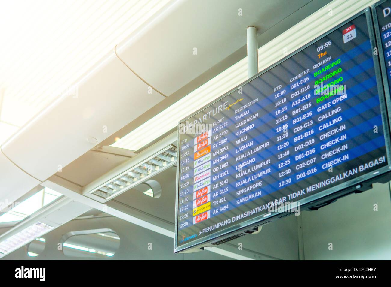 A digital departures board at an airport displaying flight information ... A digital departures board at an airport displaying flight information ...