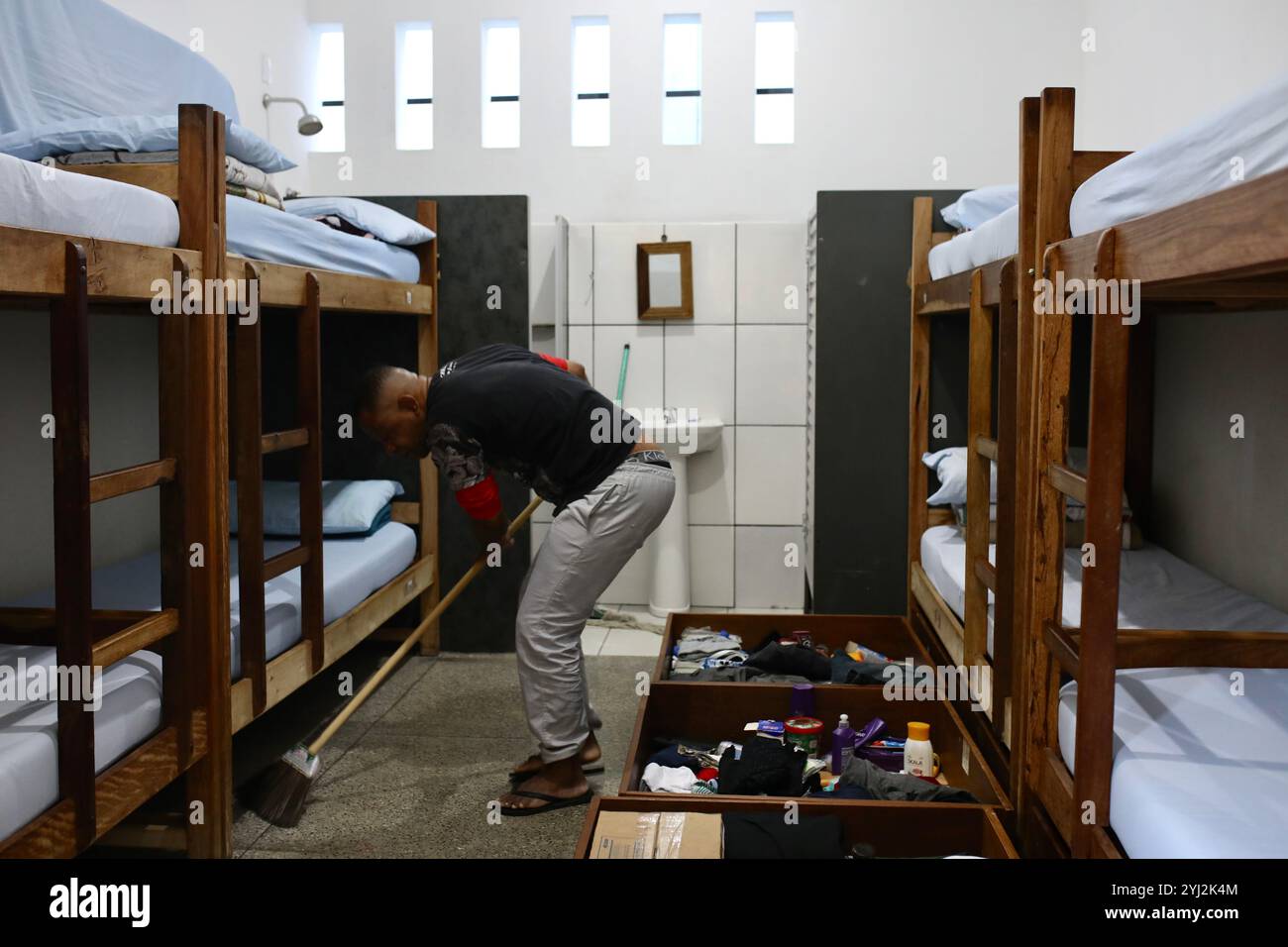 An inmate tidies up his cell at São João del-Rei APAC. It will be ...