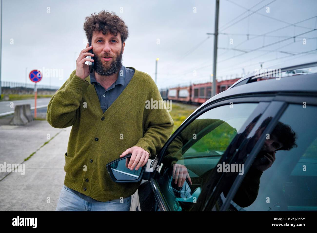 Man curly hair stands car hi-res stock photography and images - Alamy