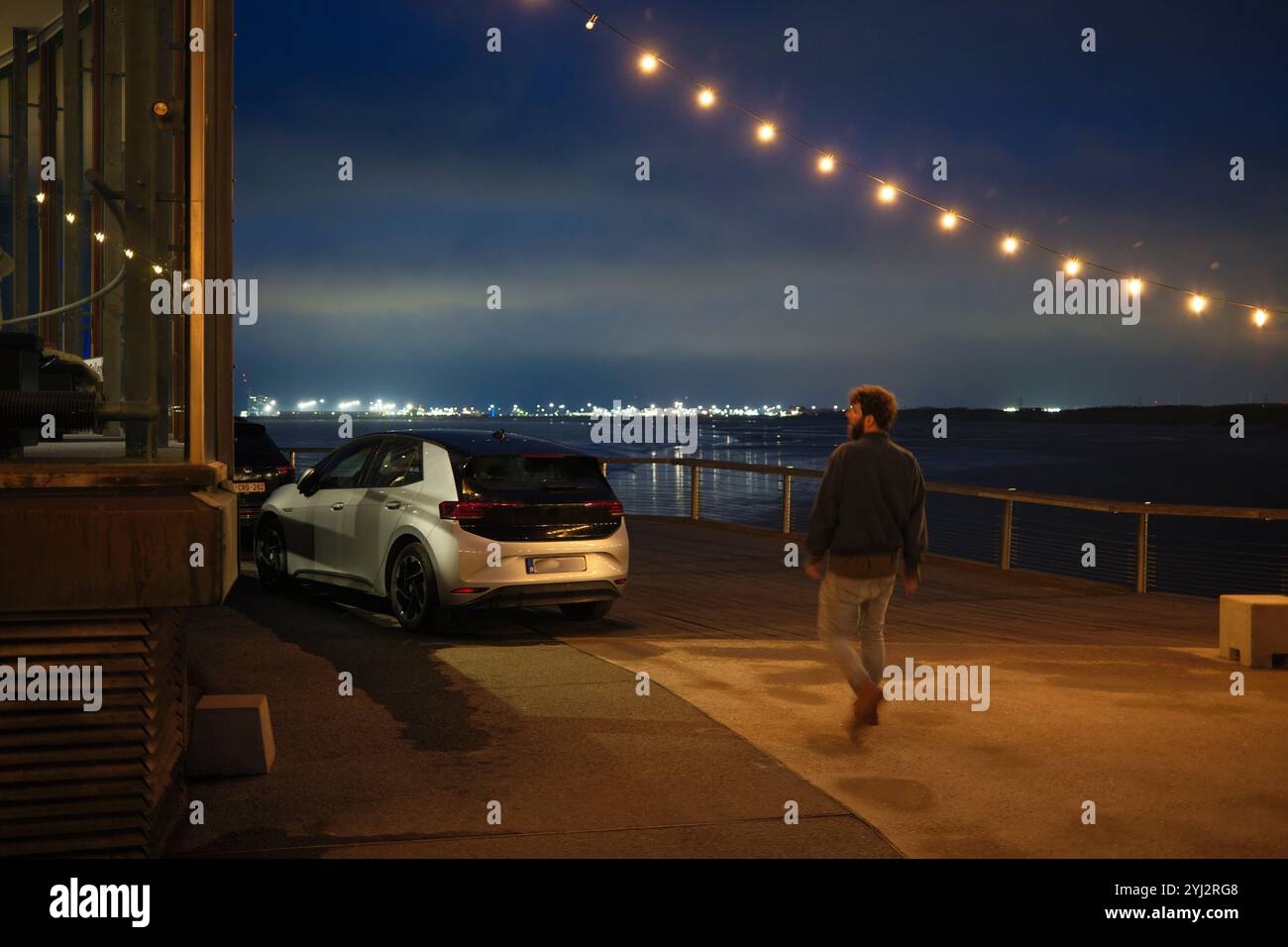 Man walking towards parked car hi-res stock photography and images - Alamy