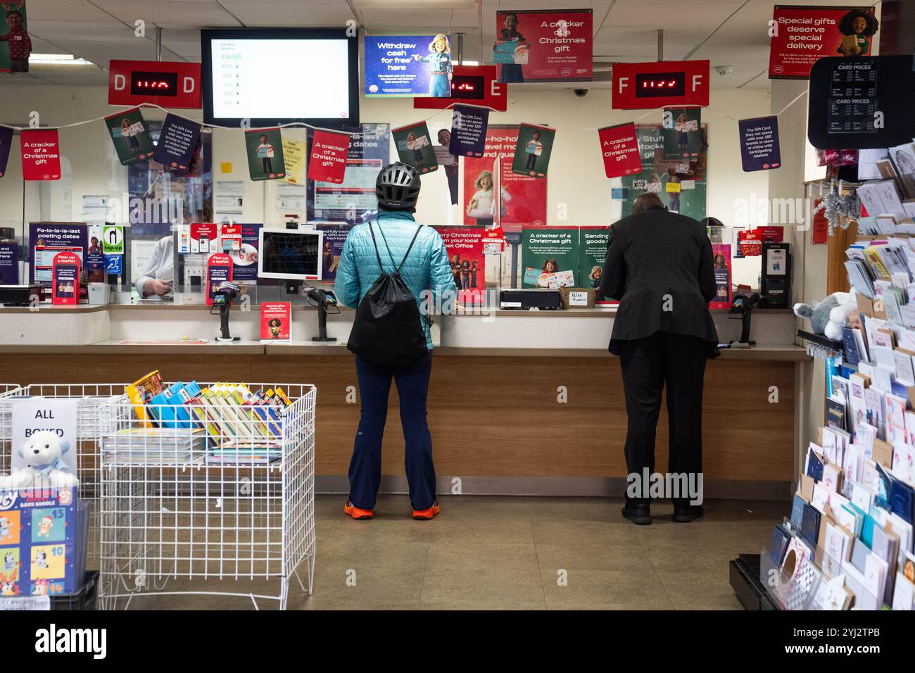 People inside a branch of the Post Office in Paddington, London. The ...
