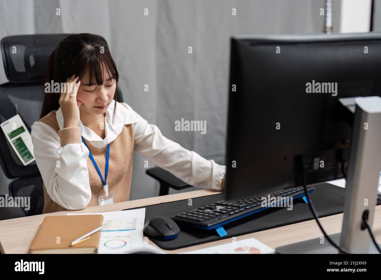 Stressed Office Worker Experiencing Office Syndrome at Desk with ...