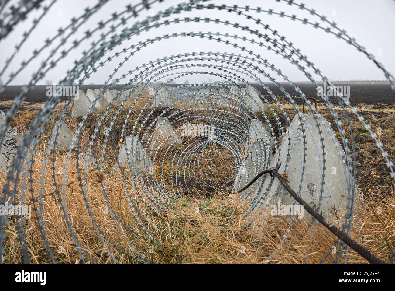 Dragon's teeth fortifications and barbed wire in Kharkiv region ...