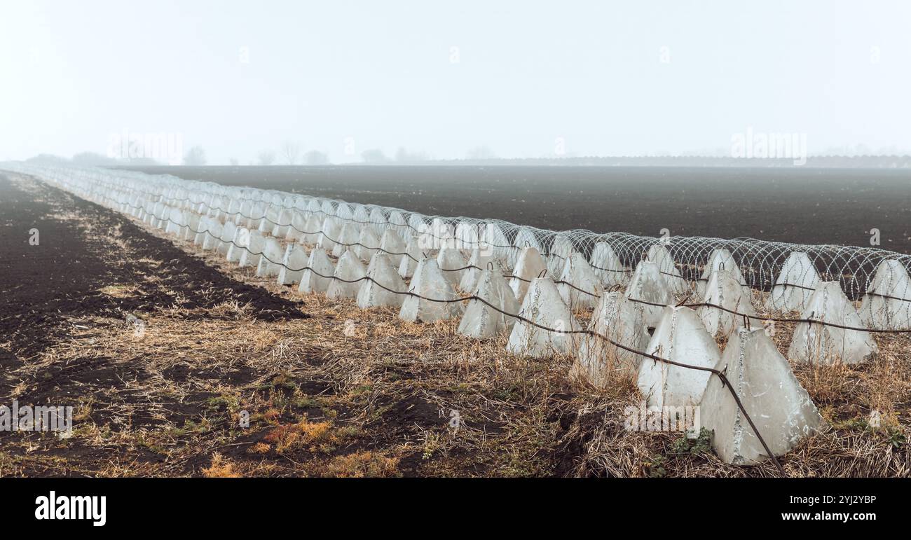 Dragon's teeth fortifications and barbed wire in Kharkiv region ...
