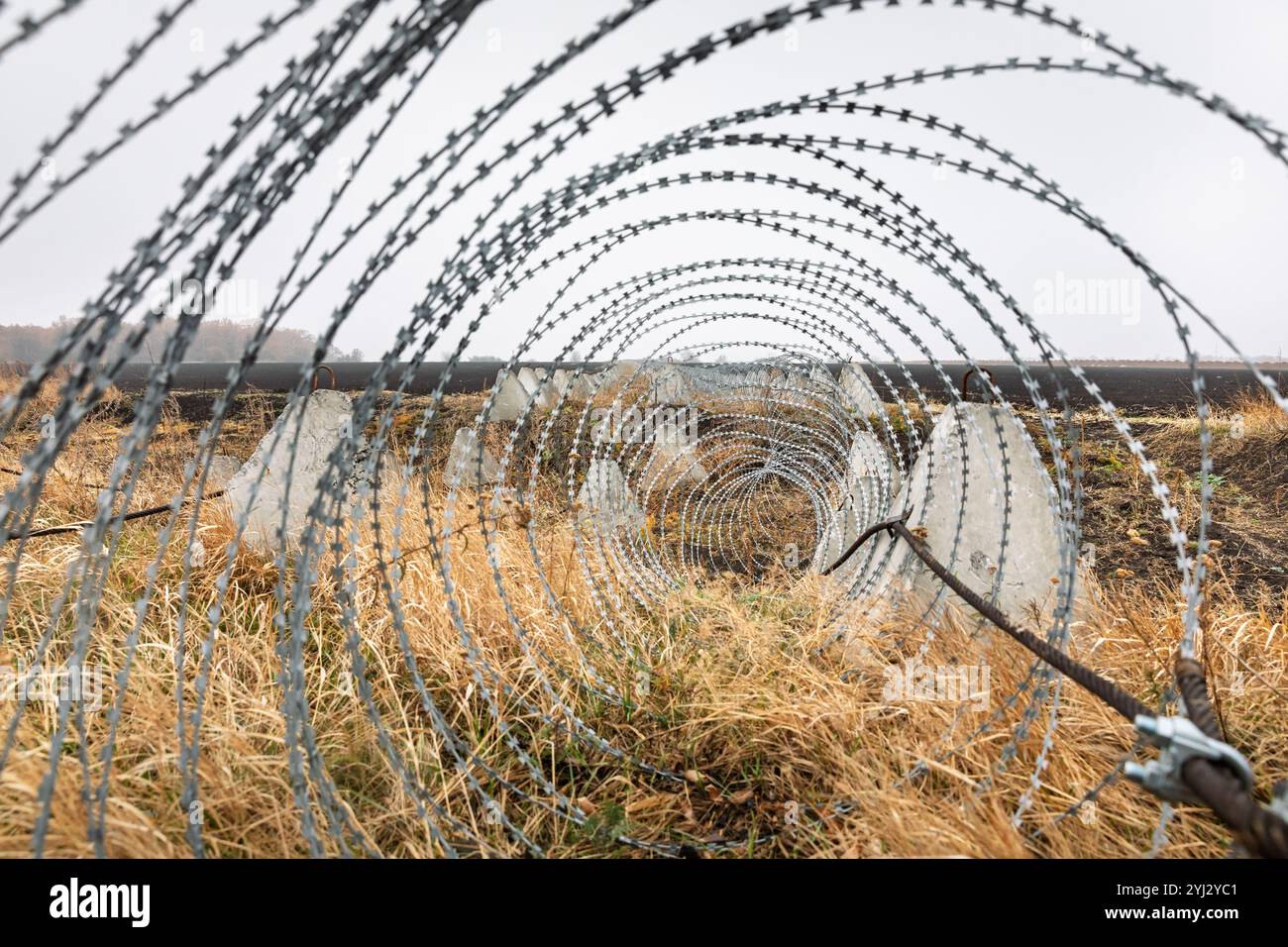 Dragon's teeth fortifications and barbed wire in Kharkiv region ...