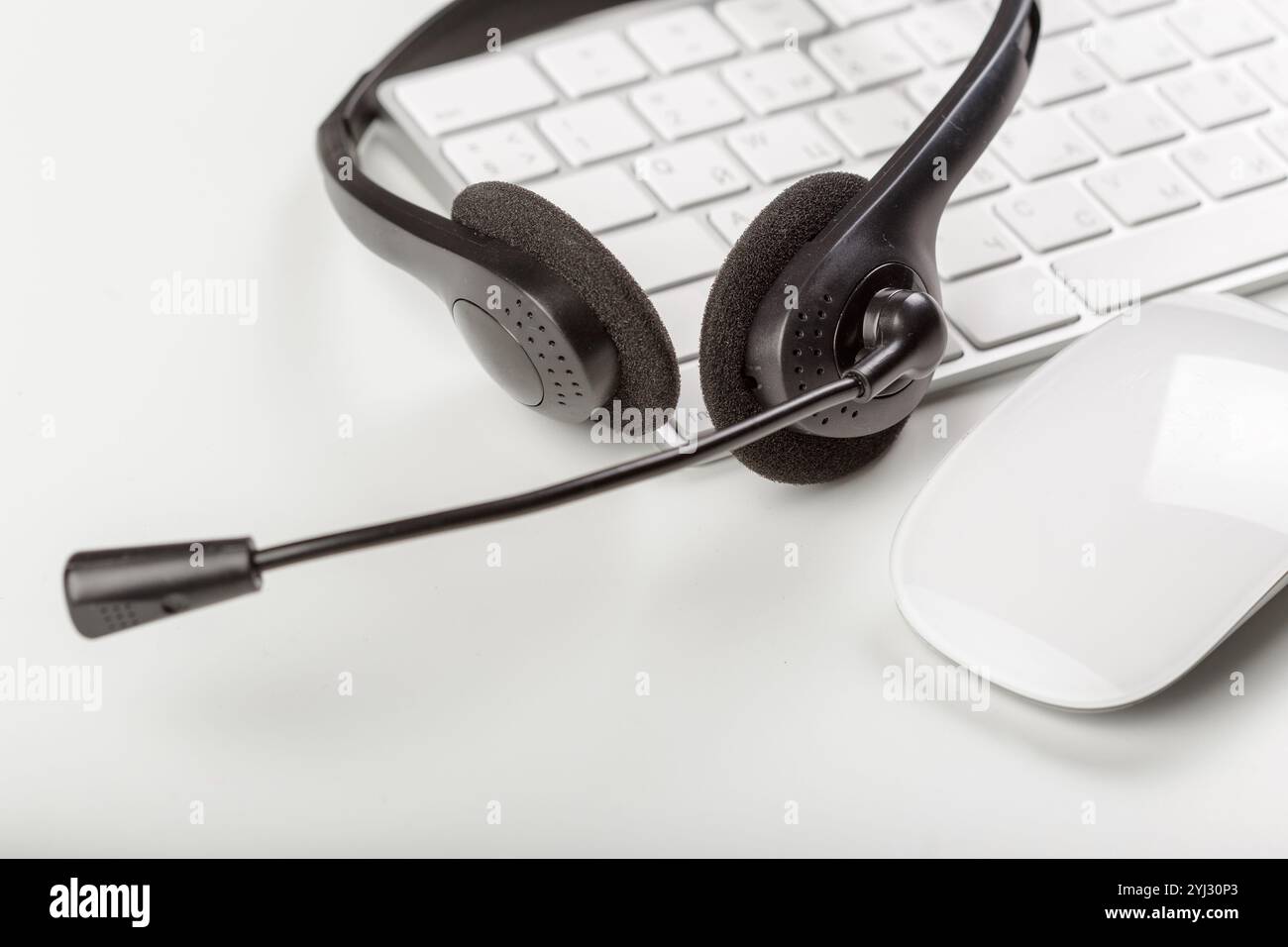 headset on keyboard computer laptop Stock Photo - Alamy