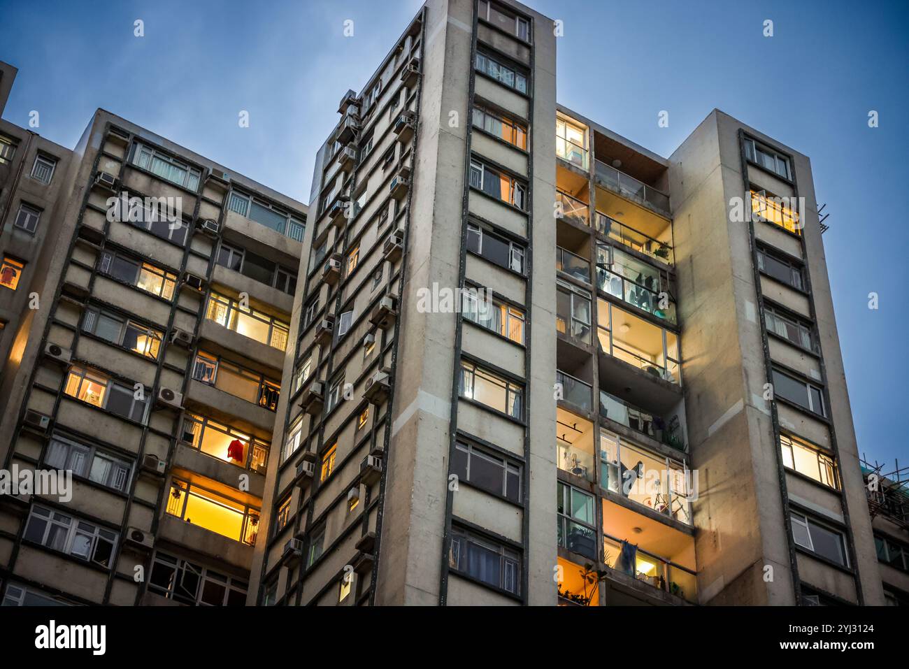 Windows illuminate as evening settles over Hong Kong, revealing ...