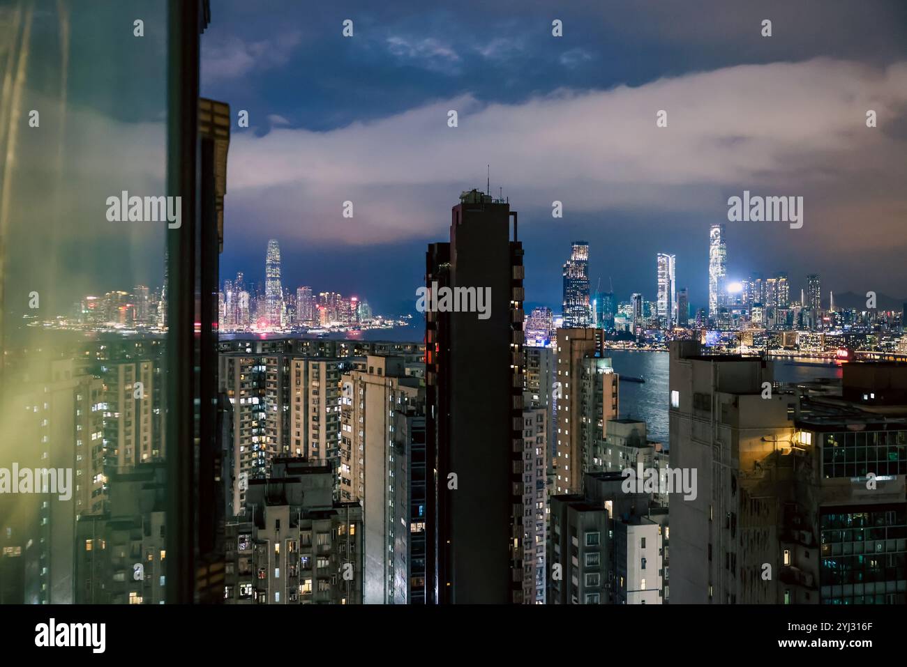 Bright city lights illuminate high-rise buildings in Hong Kong as ...