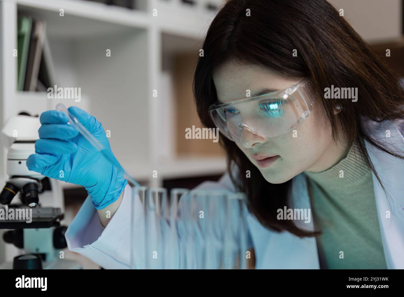 Scientist Conducting Experiment in Modern Laboratory with Advanced ...