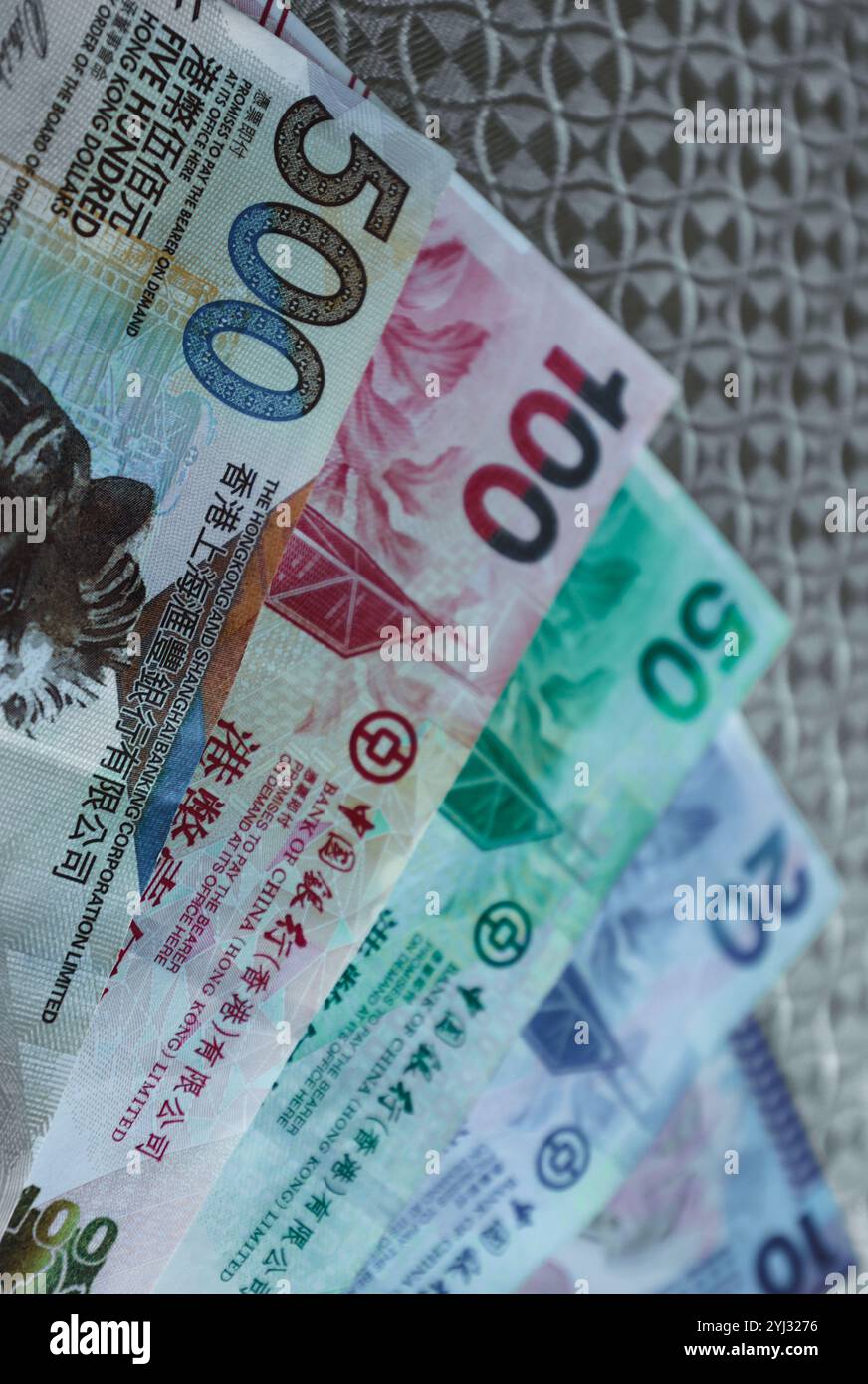 Hong Kong currency notes of different values are arranged aesthetically ...
