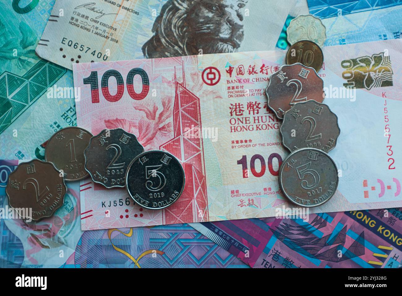 Multiple denominations of Hong Kong currency are shown, featuring ...