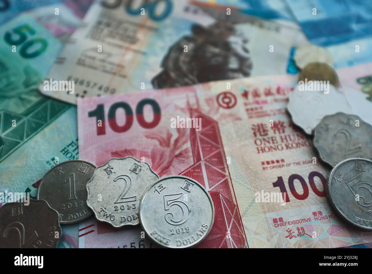 Detailed view of various Hong Kong banknotes and coins scattered ...