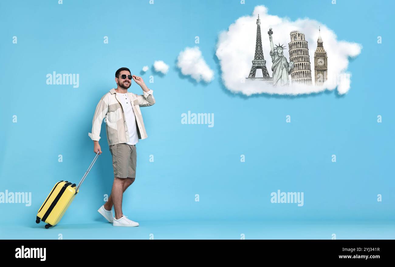 Happy traveler with suitcase walking and dreaming about journey on ...