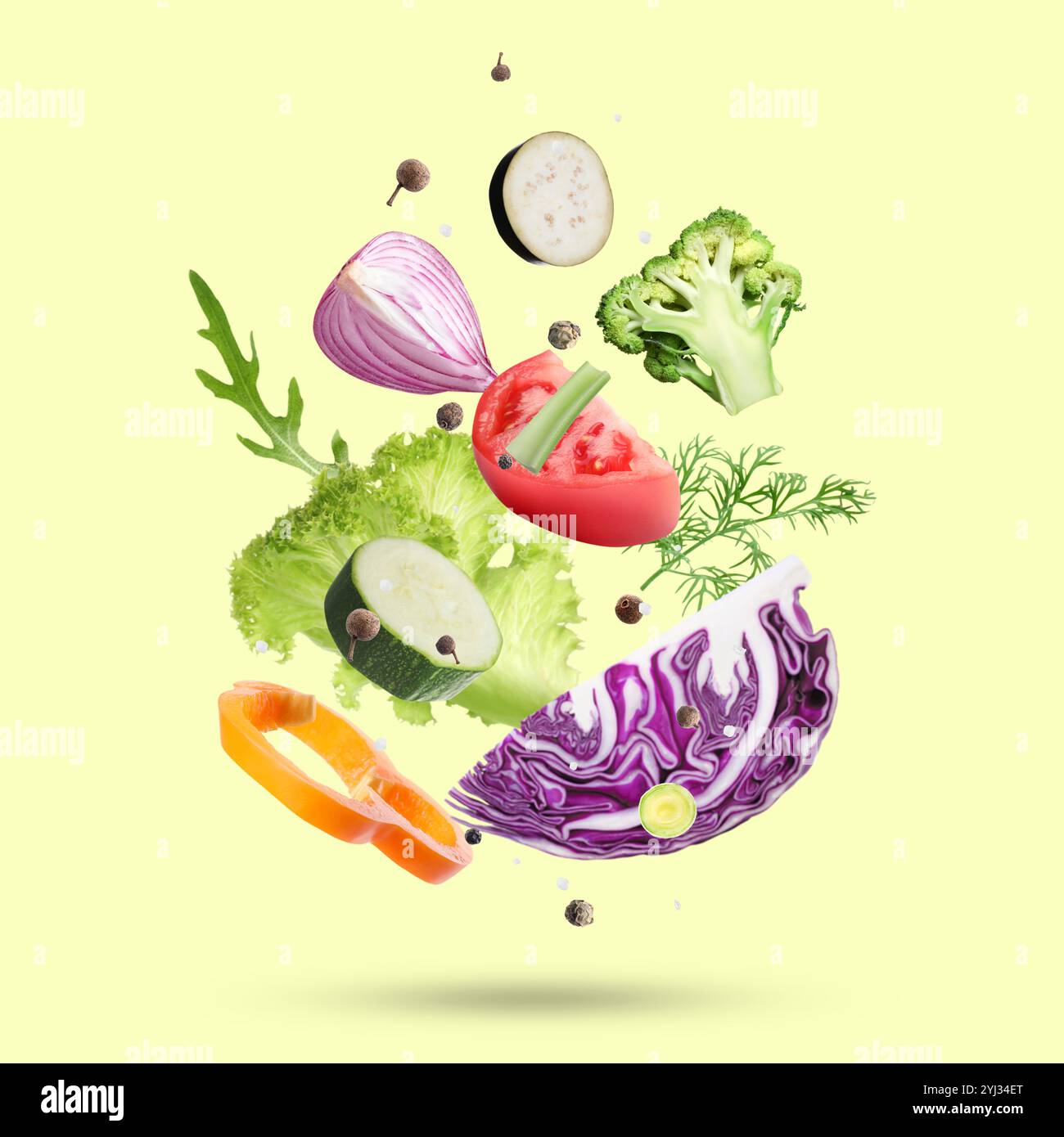 Fresh vegetables, herbs and spices in air on beige background Stock ...