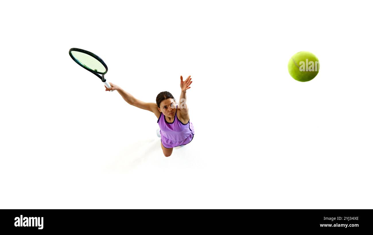 Dynamic overhead shot of tennis player, arm extended for impactful ...