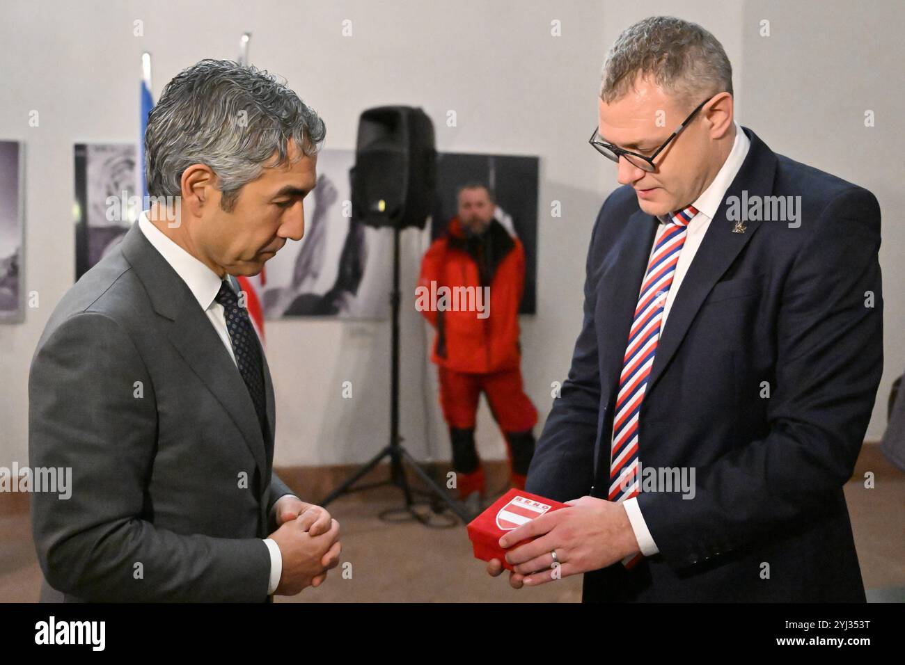 Zbynek Solc (right), director of the Brno Municipal Museum hands over ...