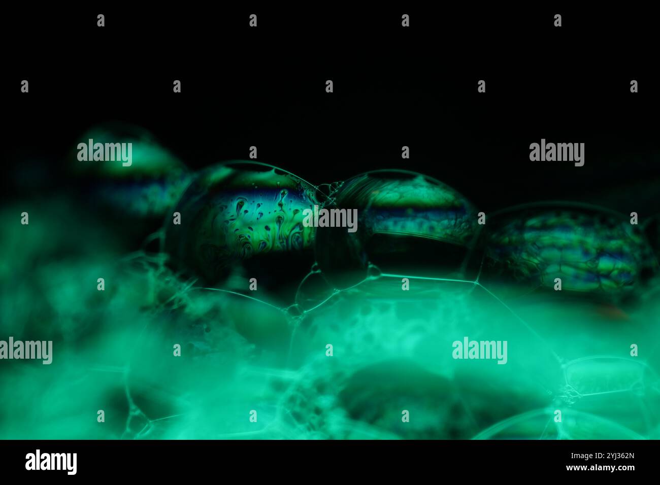 Green liquid phenomenal structure, green oils on a dark background ...