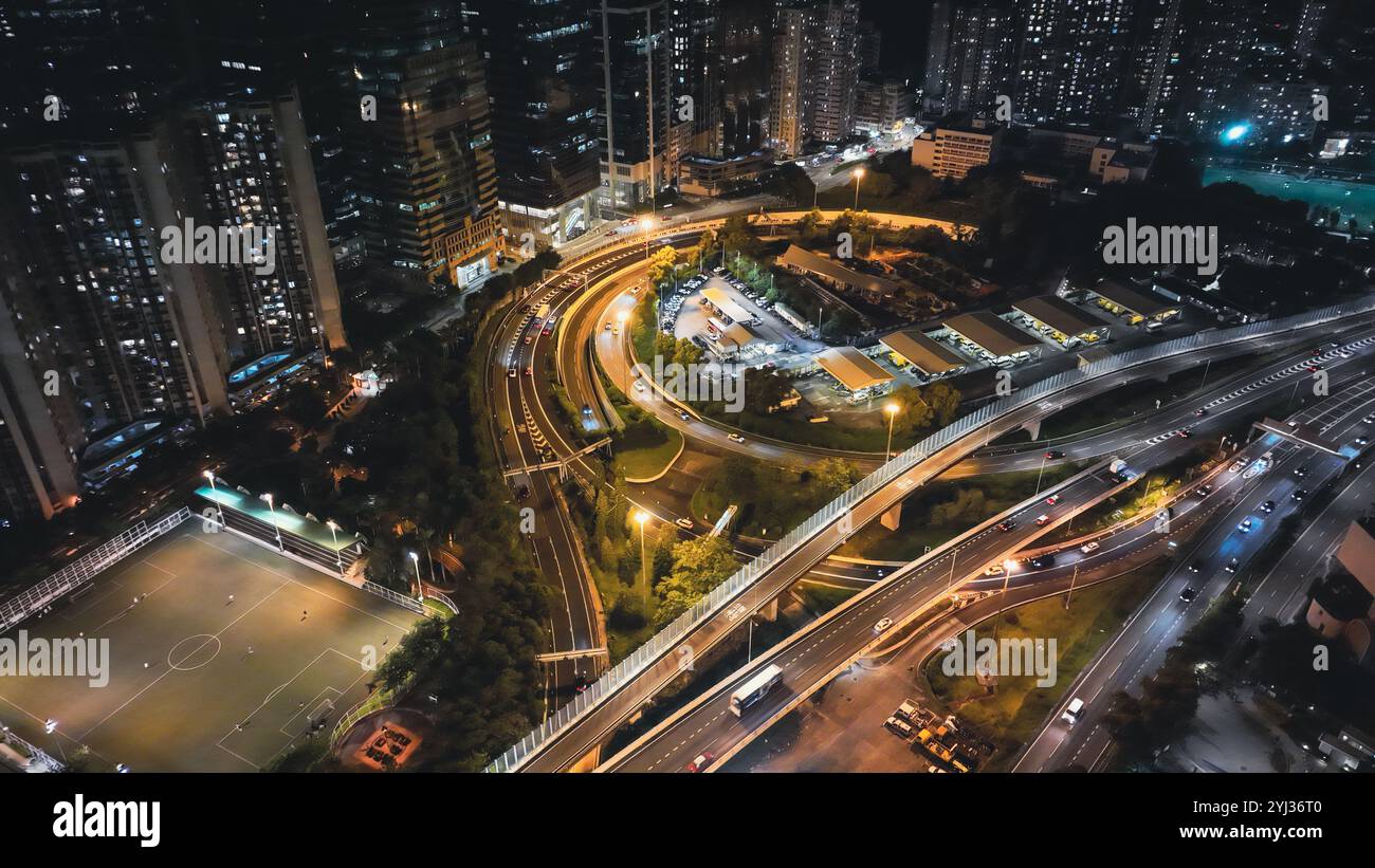 Aerial view of Hong Kong at night, highlighting illuminated buildings ...