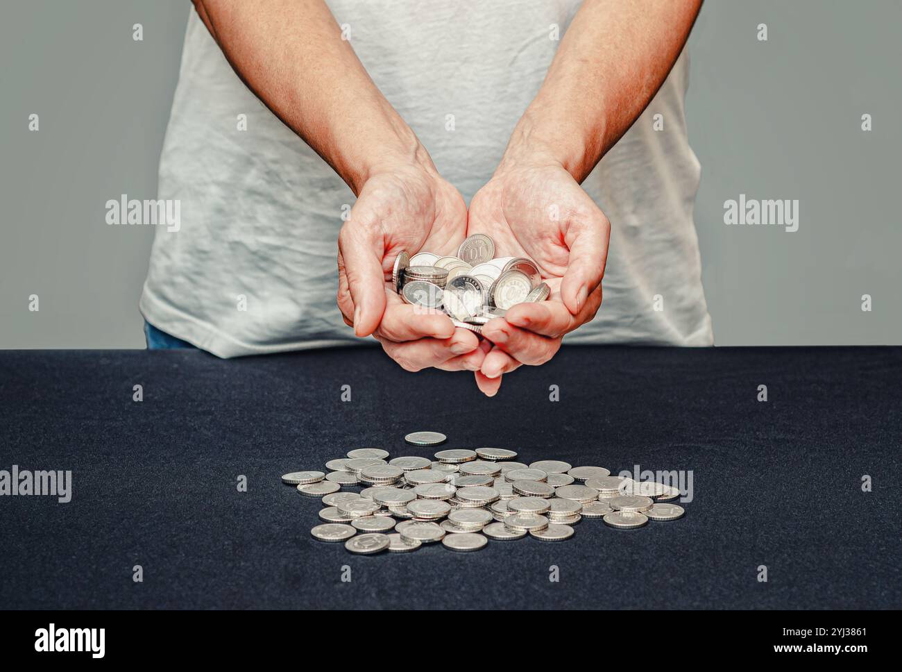 Silver coins in female hands on blurred backdrop. Importance of ...