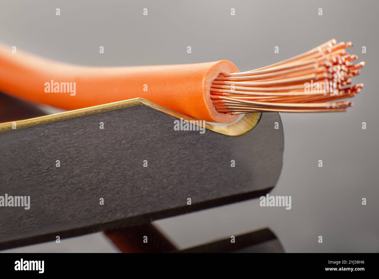 Copper Wire Cable Close Up on Cutting Blade Stock Photo - Alamy