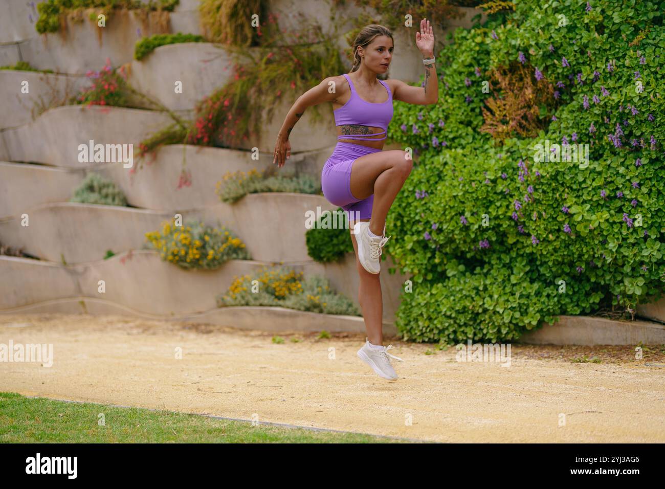 An Active Woman Engaging in Exercise Outdoors While Wearing Stylish and ...