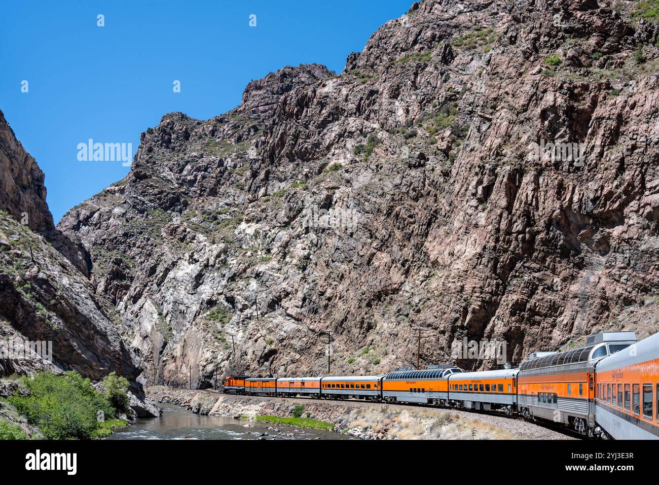 Royal Gorge railroad train chugs along the Arkansas River, near Cañon ...