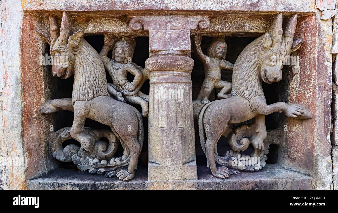 Carved sculpture of a mythical Hindu animal on the porch window of ...