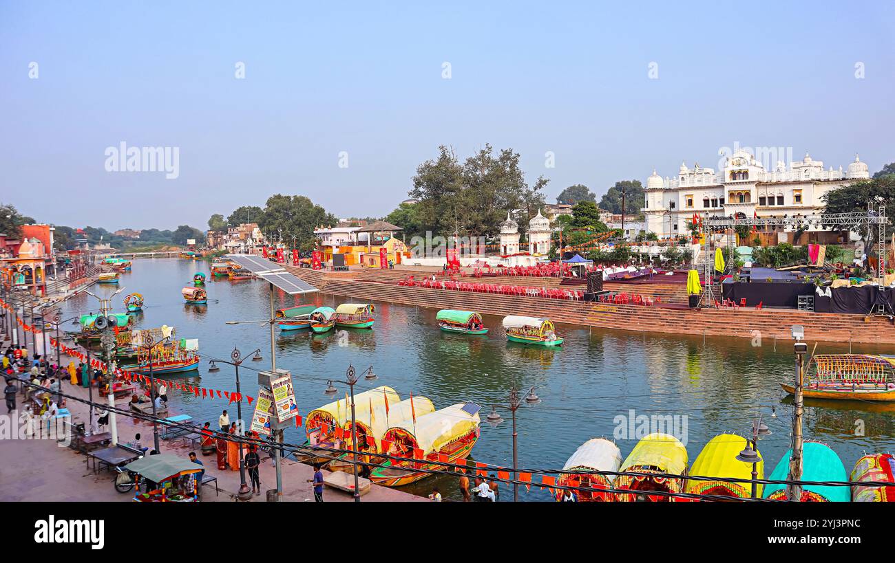 View of Ram Ghat with ferry boats on the Mandakini River, located in ...