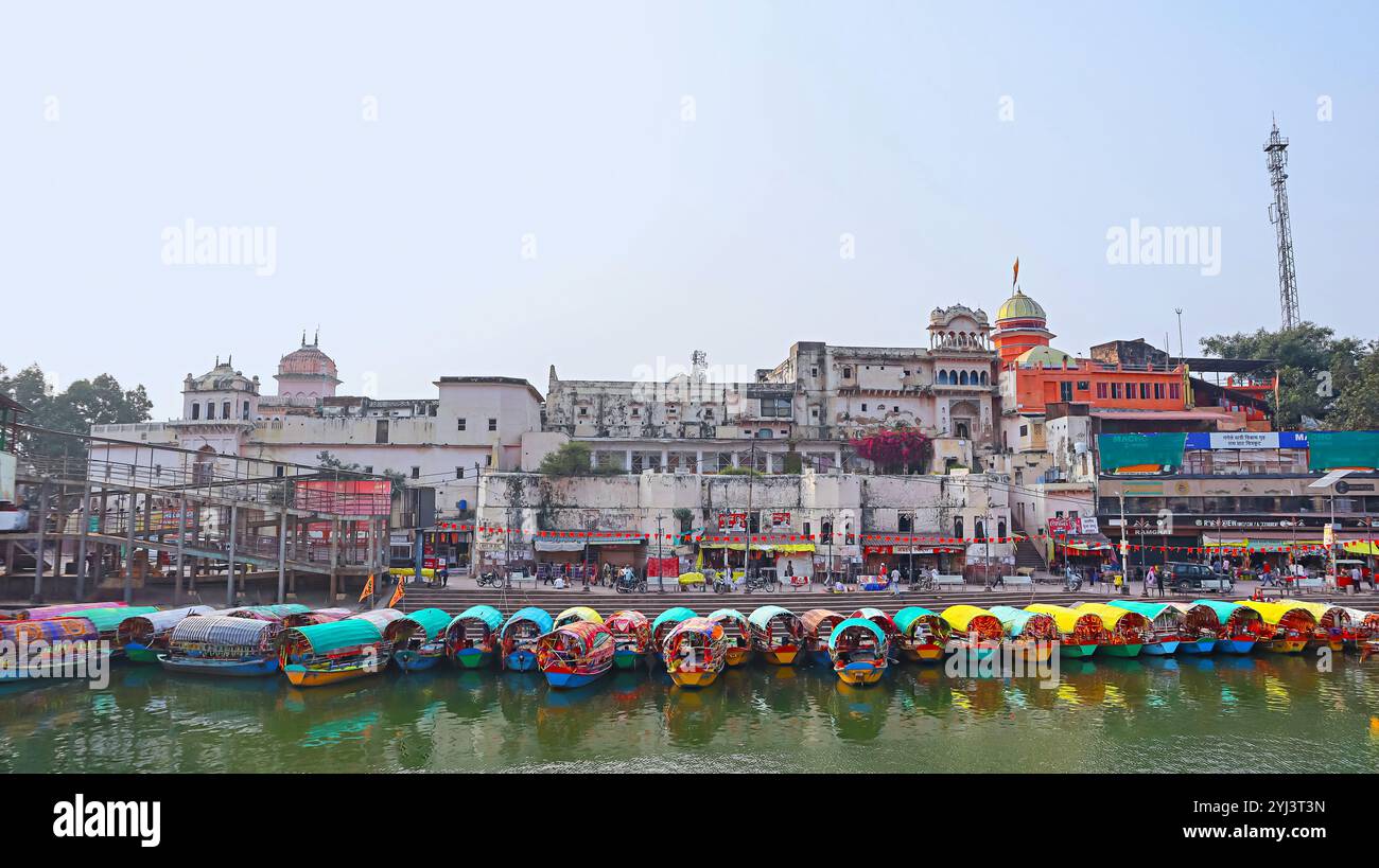 View of Ram Ghat with ferry boats on the Mandakini River, located in ...