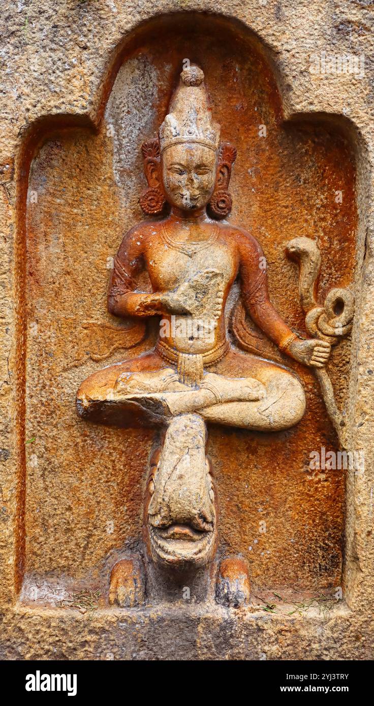 Carved sculpture of the god Varuna outside Hayagriva Madhava Temple ...