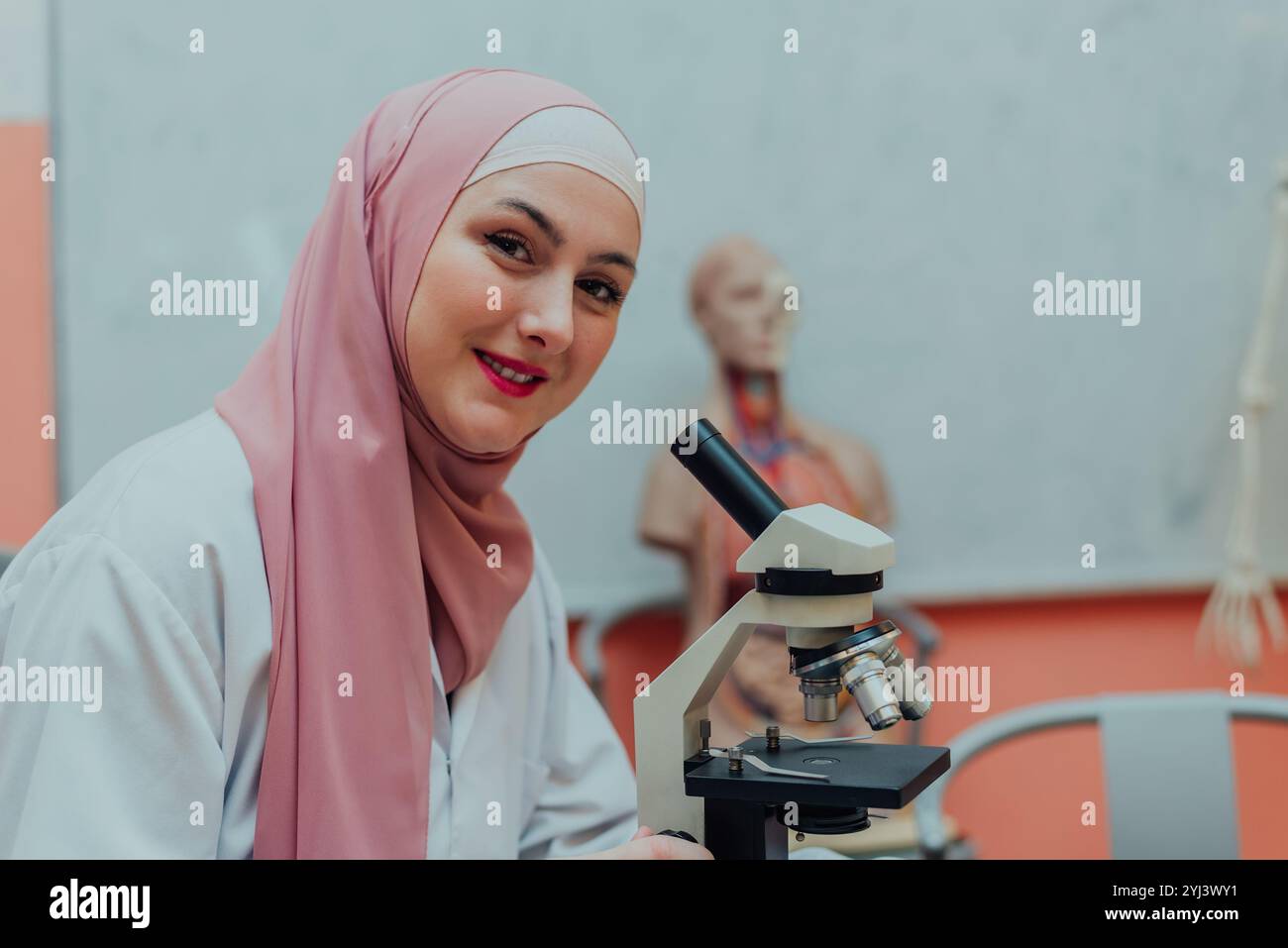 A female Muslim scientist student doing science research looking ...