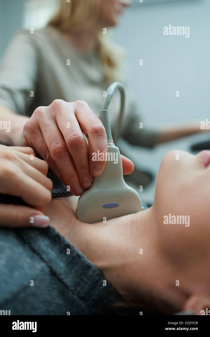 Examination using an ultrasound machine at work. Modern clinical ...
