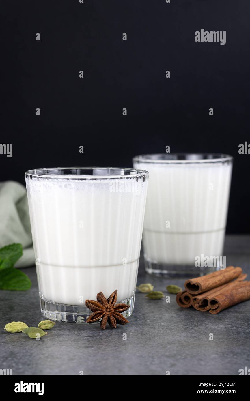 A glass of Indian cold drink based on yogurt dahi - Lassi with spices ...