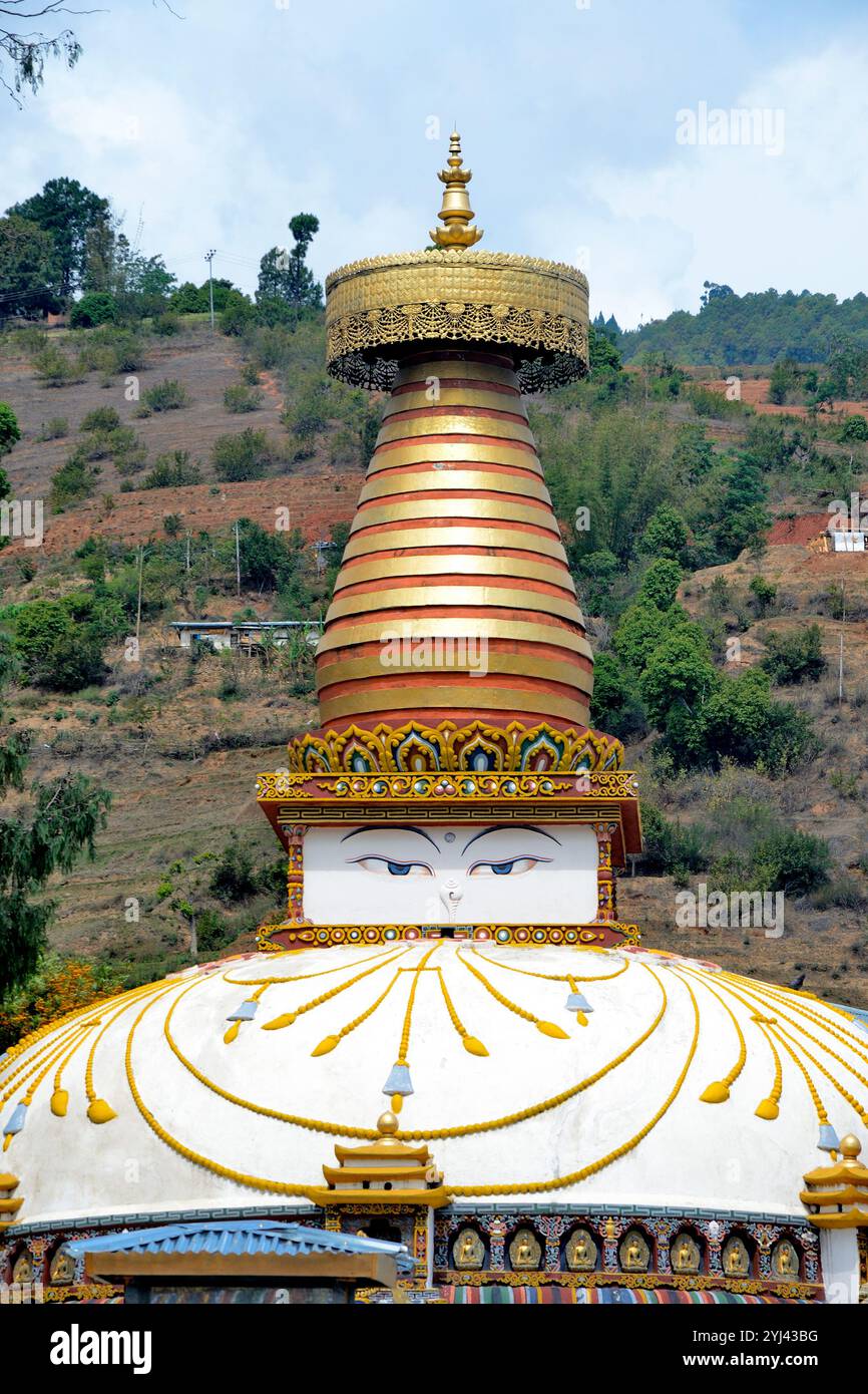Colorful small chorten with eyes painted on it, on the way to dzong ...