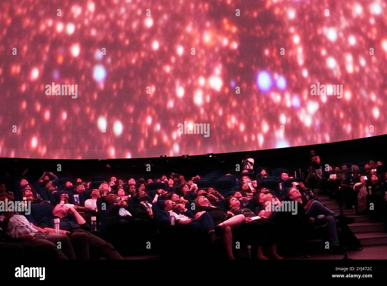 People watch images of the Milky Way projected at the Wits Anglo ...