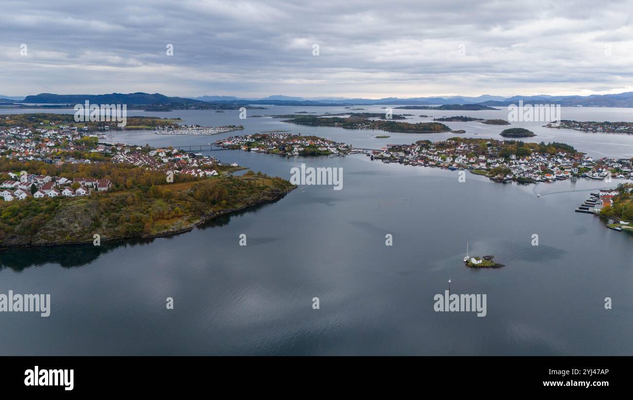 Aerial view of a coastal town with scattered islands and calm waters ...