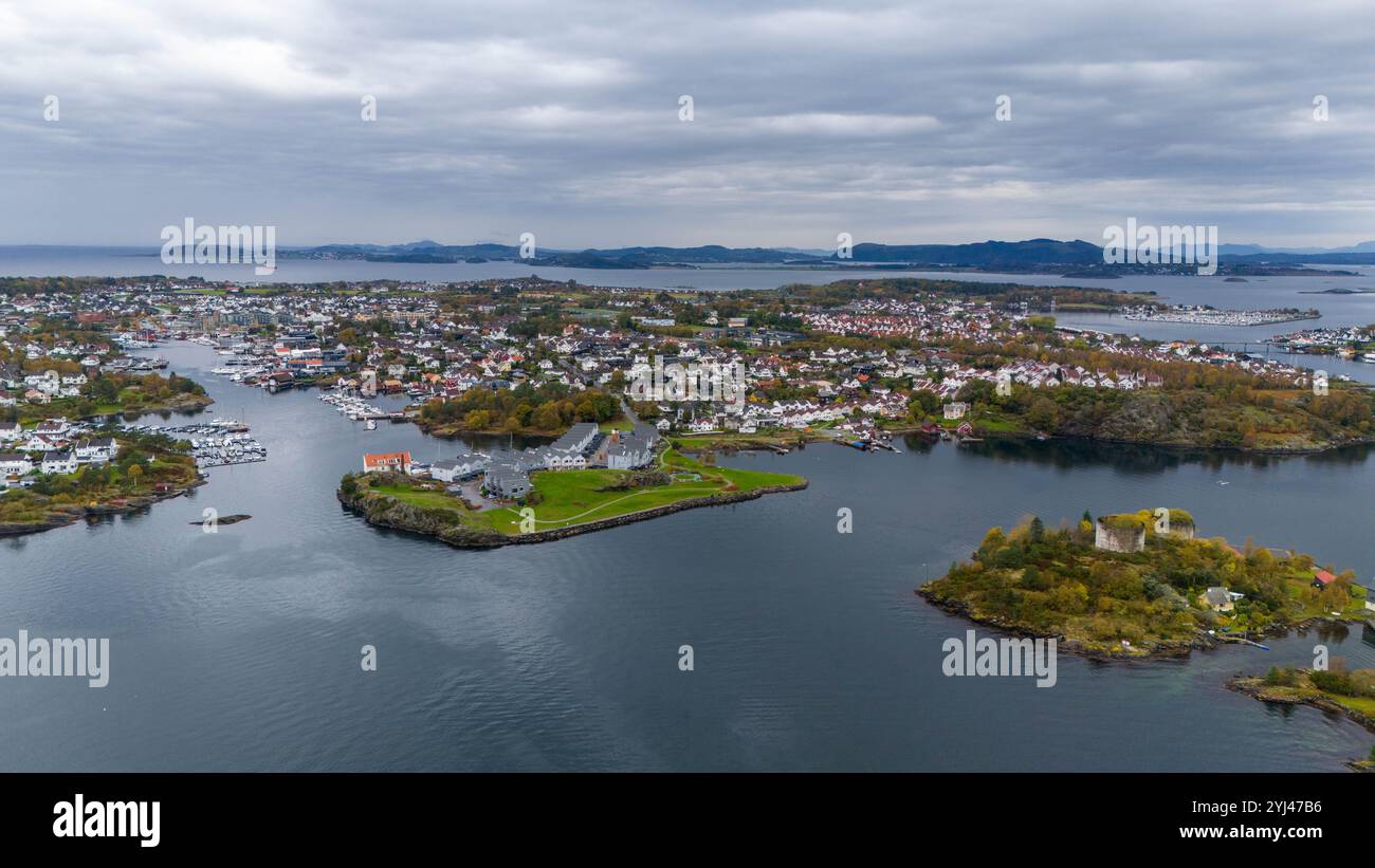 Aerial view of a coastal town with scattered islands, houses, and ...