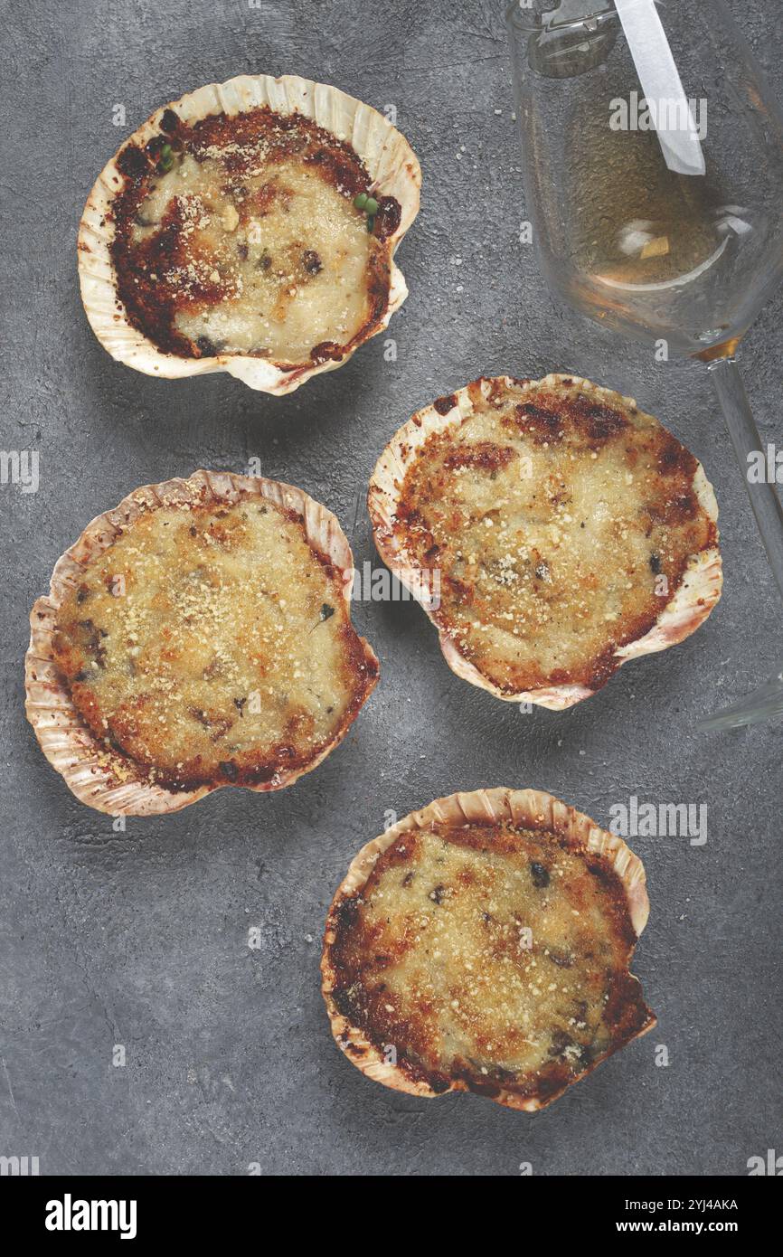 Scallop shells, stuffed, baked with cheese, in the oven, julienne with ...
