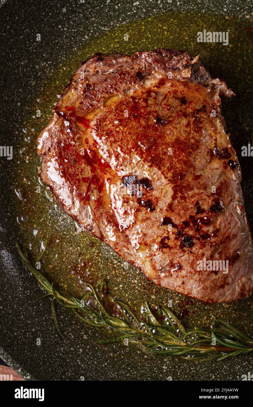Fried steak, beef steak, rib eye steak, in a frying pan, top view, no ...