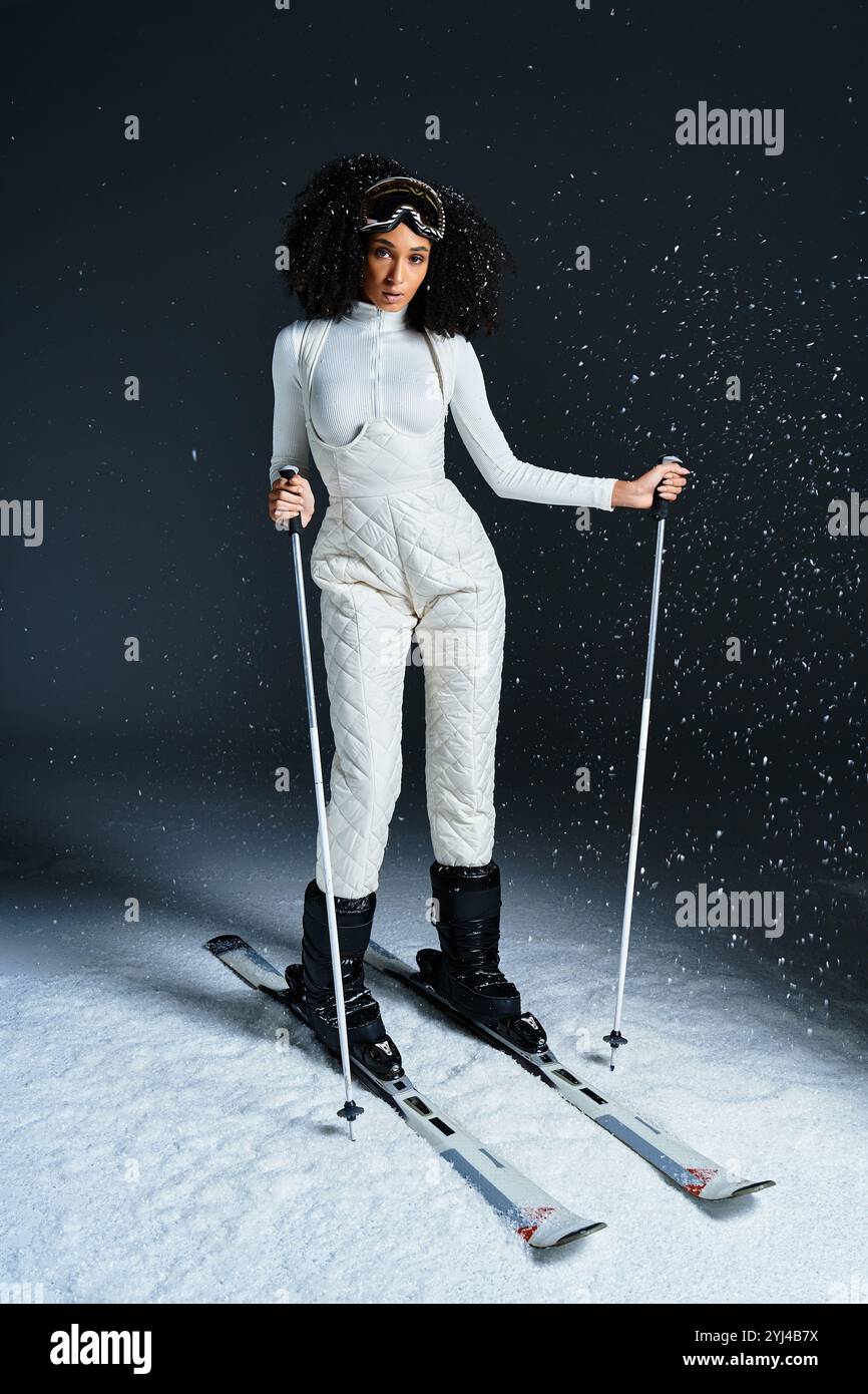 A stunning brunette African American woman models a sleek ski suit ...