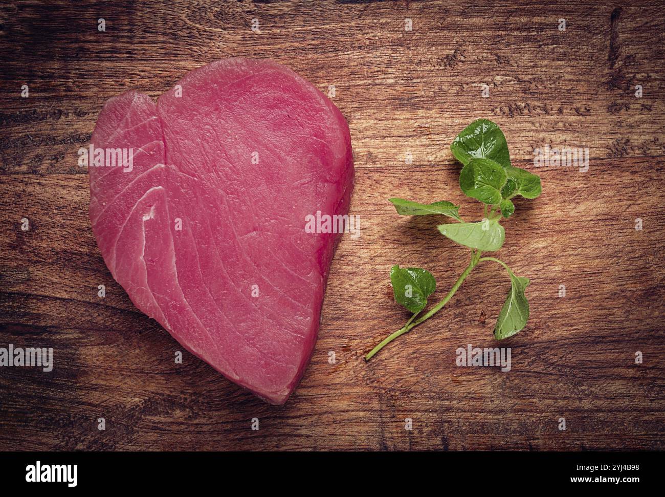 Fresh red tuna fillet, for steak, raw, top view, on a cutting board, no ...