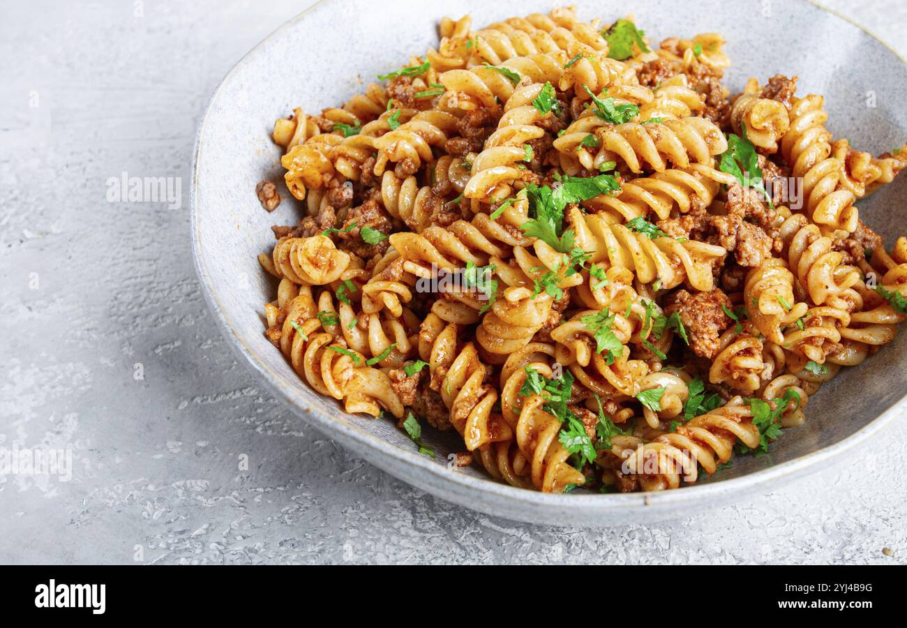 Pasta in navy, pasta with minced meat, gray background, homemade ...