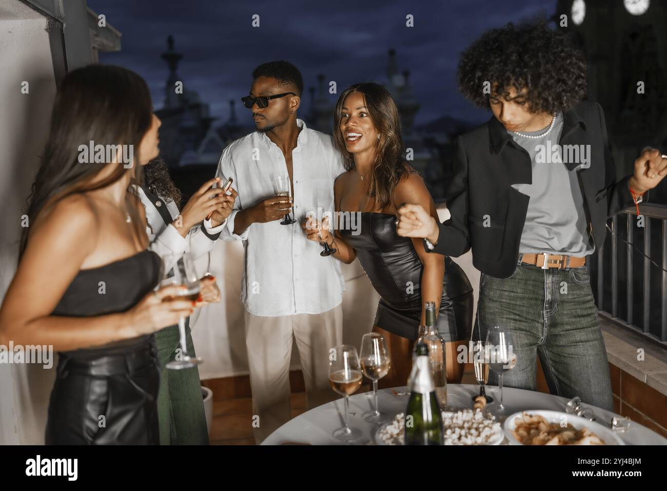 Multiracial friends having fun night hi-res stock photography and ...