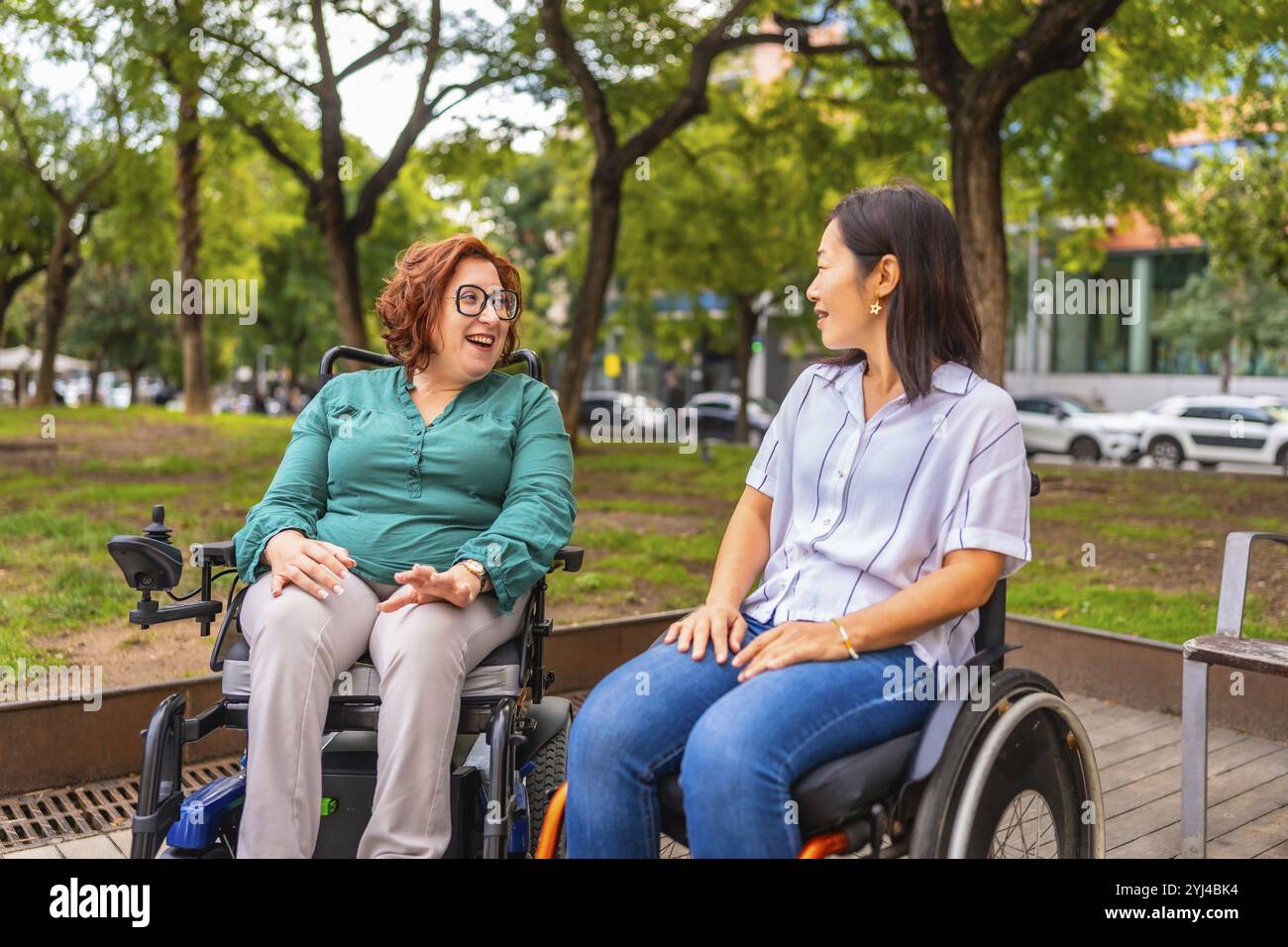 Two people in wheelchairs hi-res stock photography and images - Alamy