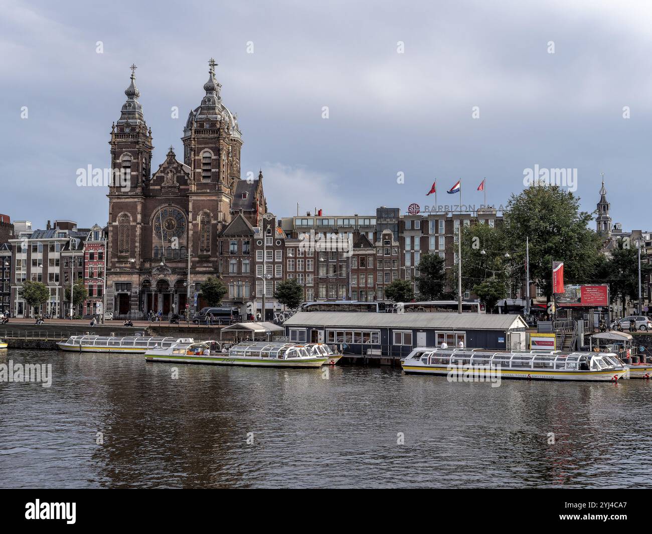 Tourist boats for the canal cruise in the harbour and in the background ...
